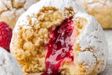 Raspberry Filled Almond Snowball Cookies - Emma's Cake Studio